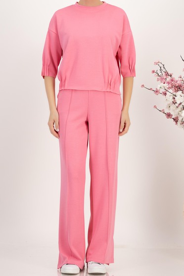 Trening din modal roz cu elastic in talie si croi evazat cu buzunare ...